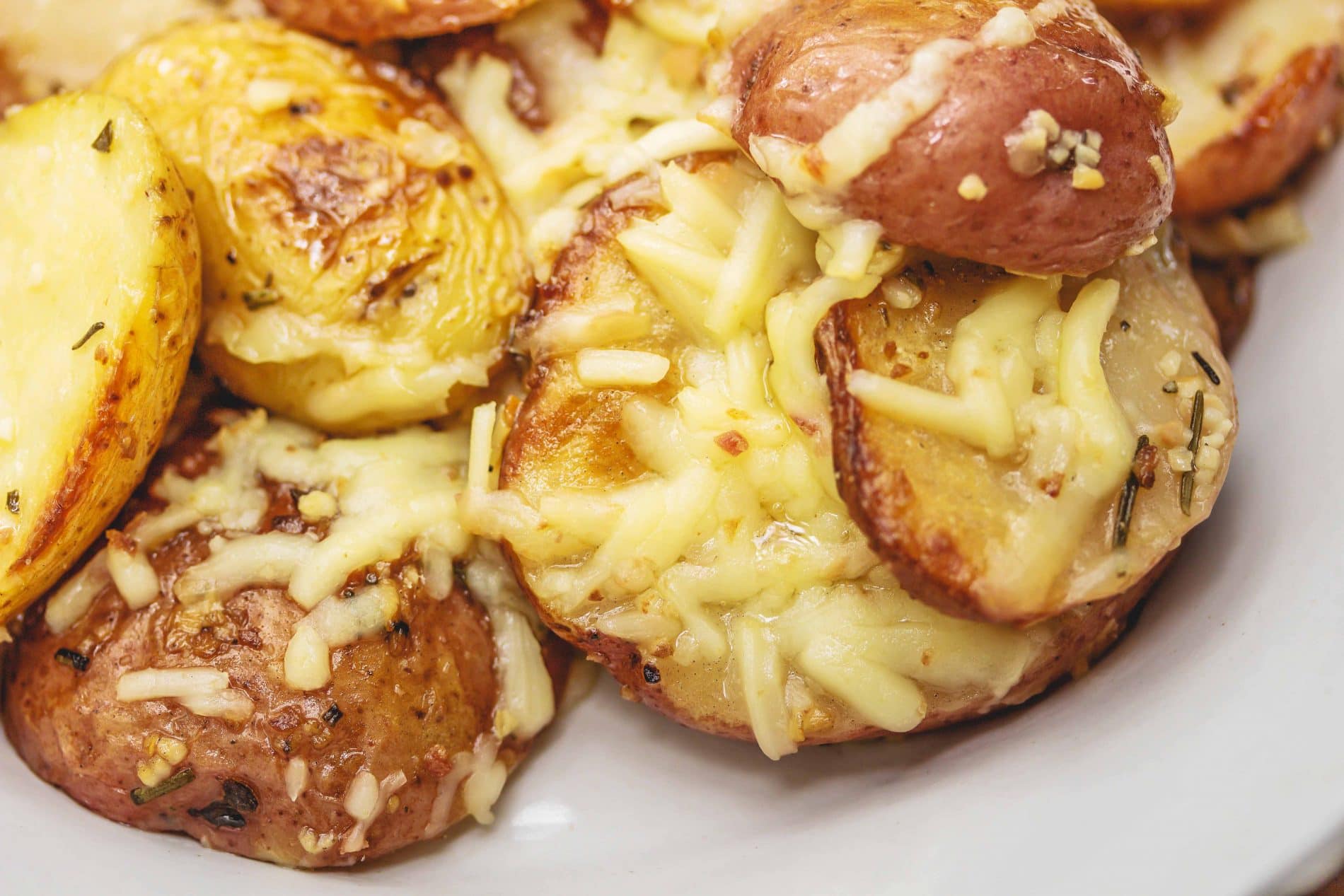 ? Cheesy Roasted Garlic And Rosemary Potatoes